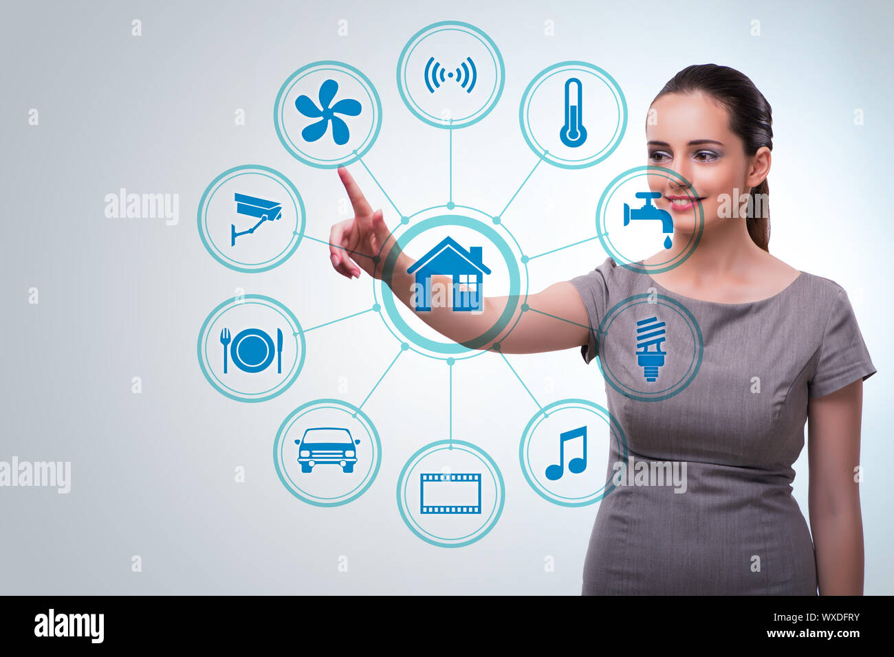 Smart home concept with woman Stock Photo - Alamy