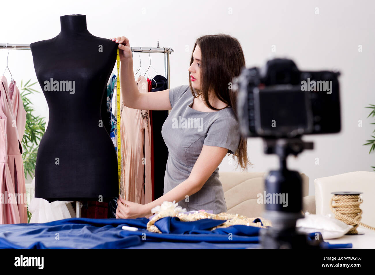 Beautiful young seamstress measuring hi-res stock photography and ...