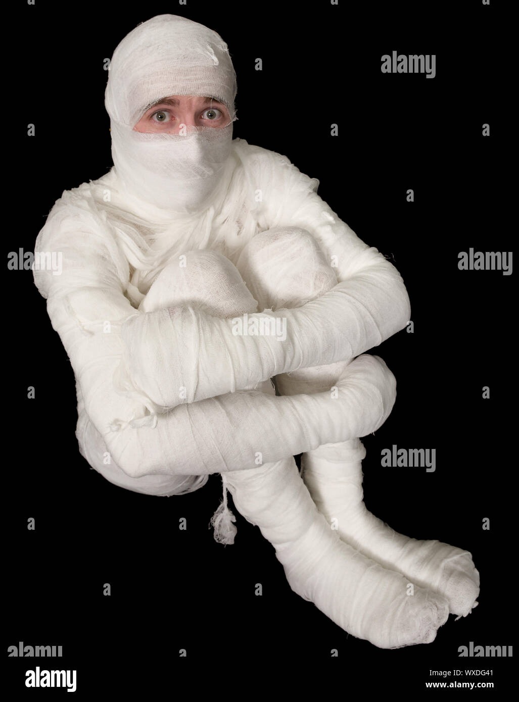 The funny Egyptian mummy emo sitting on a black background Stock Photo ...