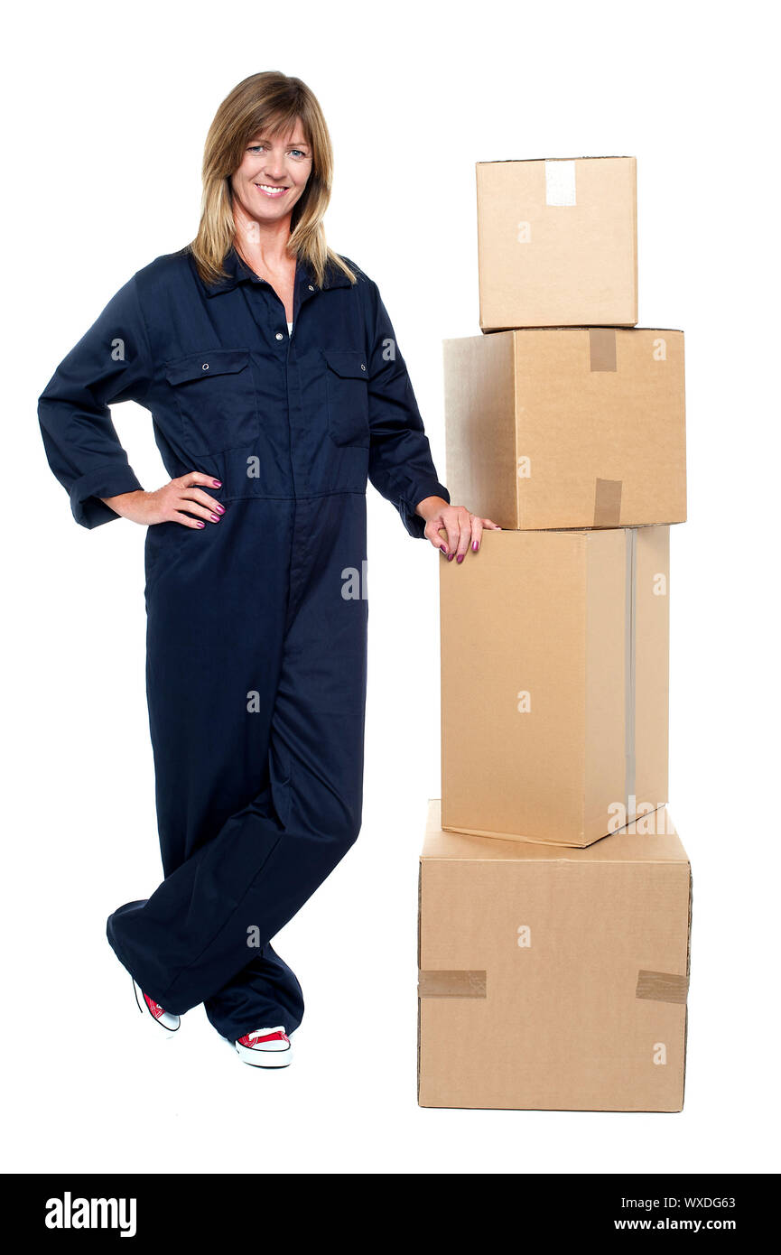 Full length portrait of delivery woman in uniform striking stylish pose ...