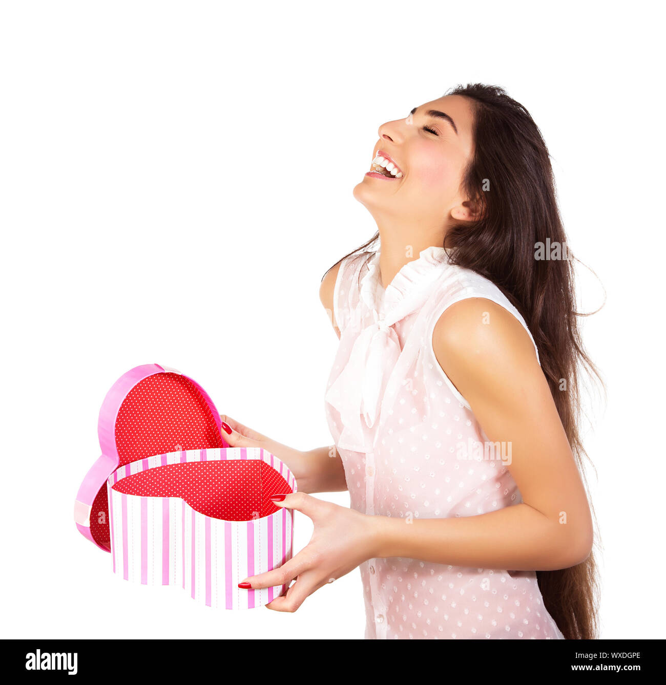 Image of pretty happy woman opening gift box isolated on white ...