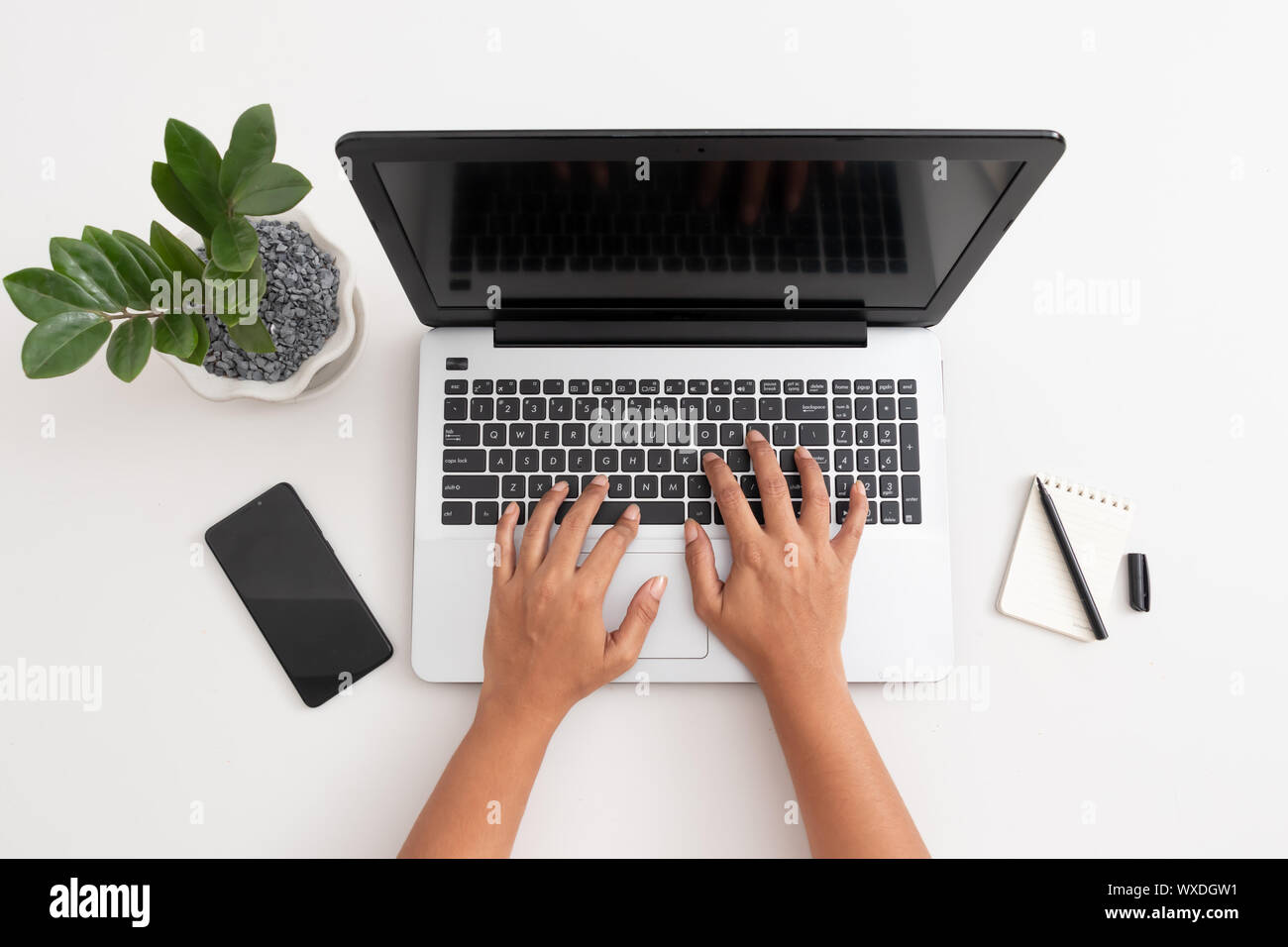 Business woman type on laptop computer on white office desk Stock Photo ...