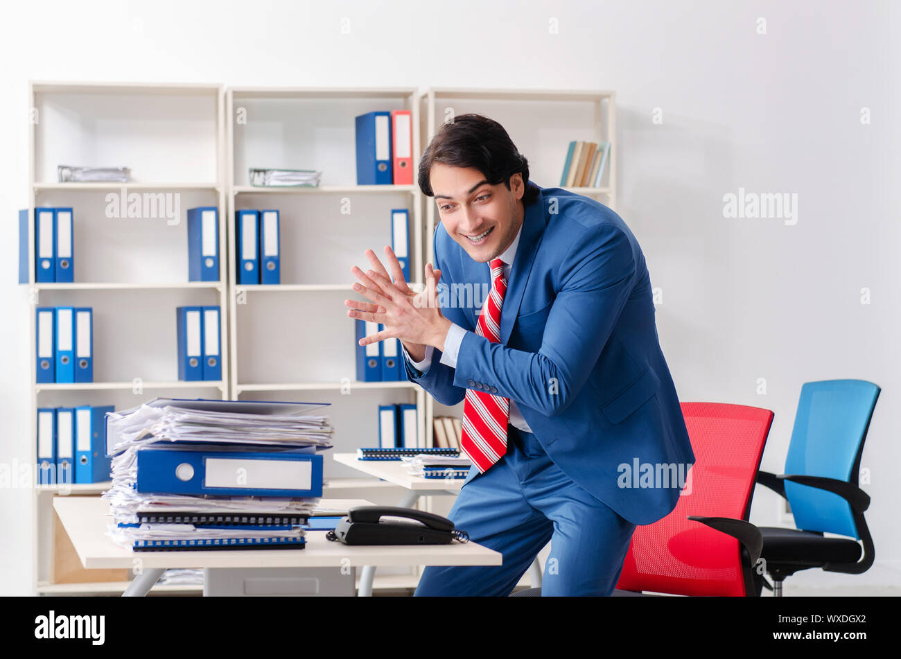 Cheerful office worker reaching hi-res stock photography and images - Alamy