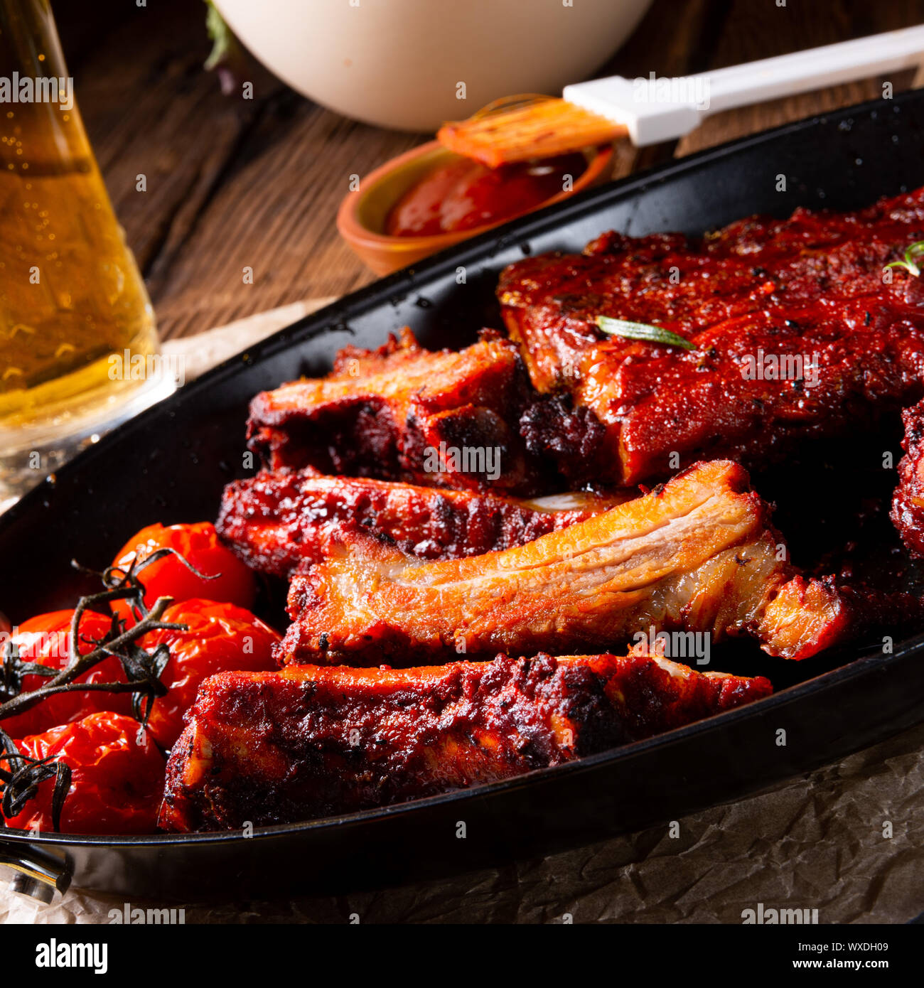 Grilled ribs in spicy marinade with salad and vegetables Stock Photo ...