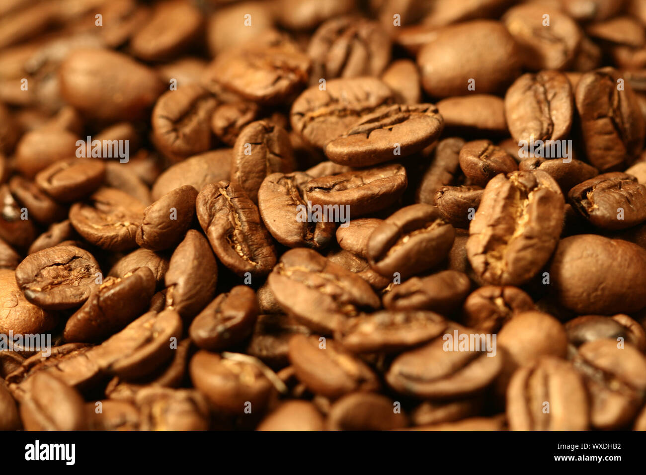 very hot big black coffee beans macro Stock Photo - Alamy