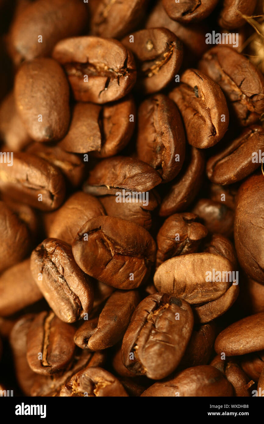 very hot big black coffee beans macro Stock Photo - Alamy