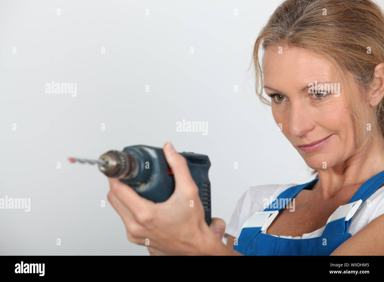 Women holding electric drill Stock Photo - Alamy