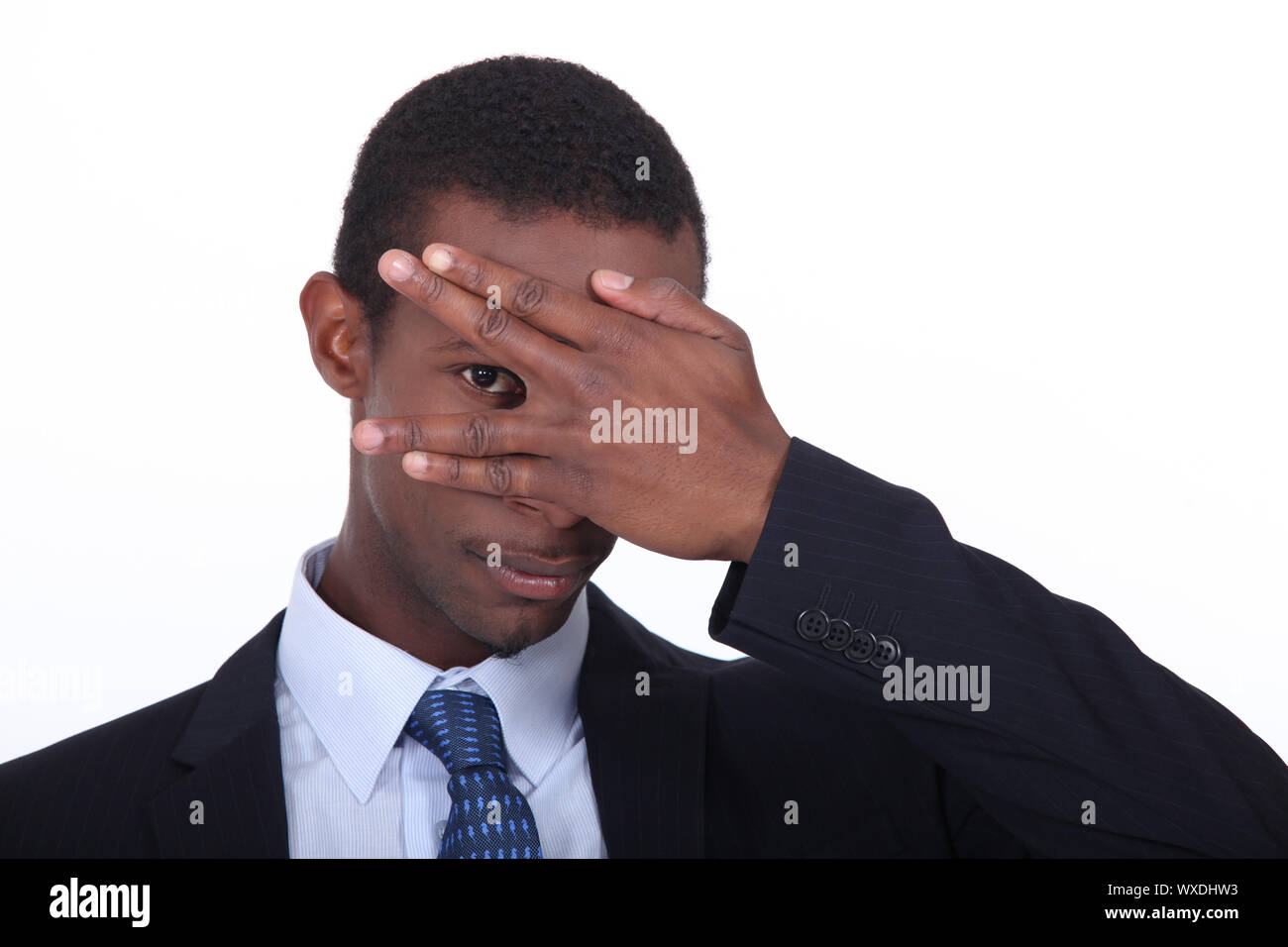 African descent hand covering face hi-res stock photography and images ...