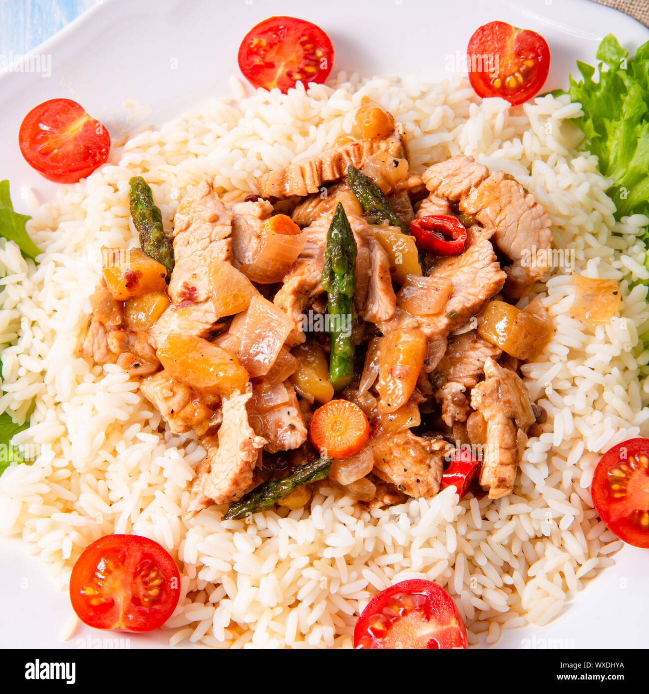 Turkey fricassee on rice with asparagus and paprika Stock Photo - Alamy