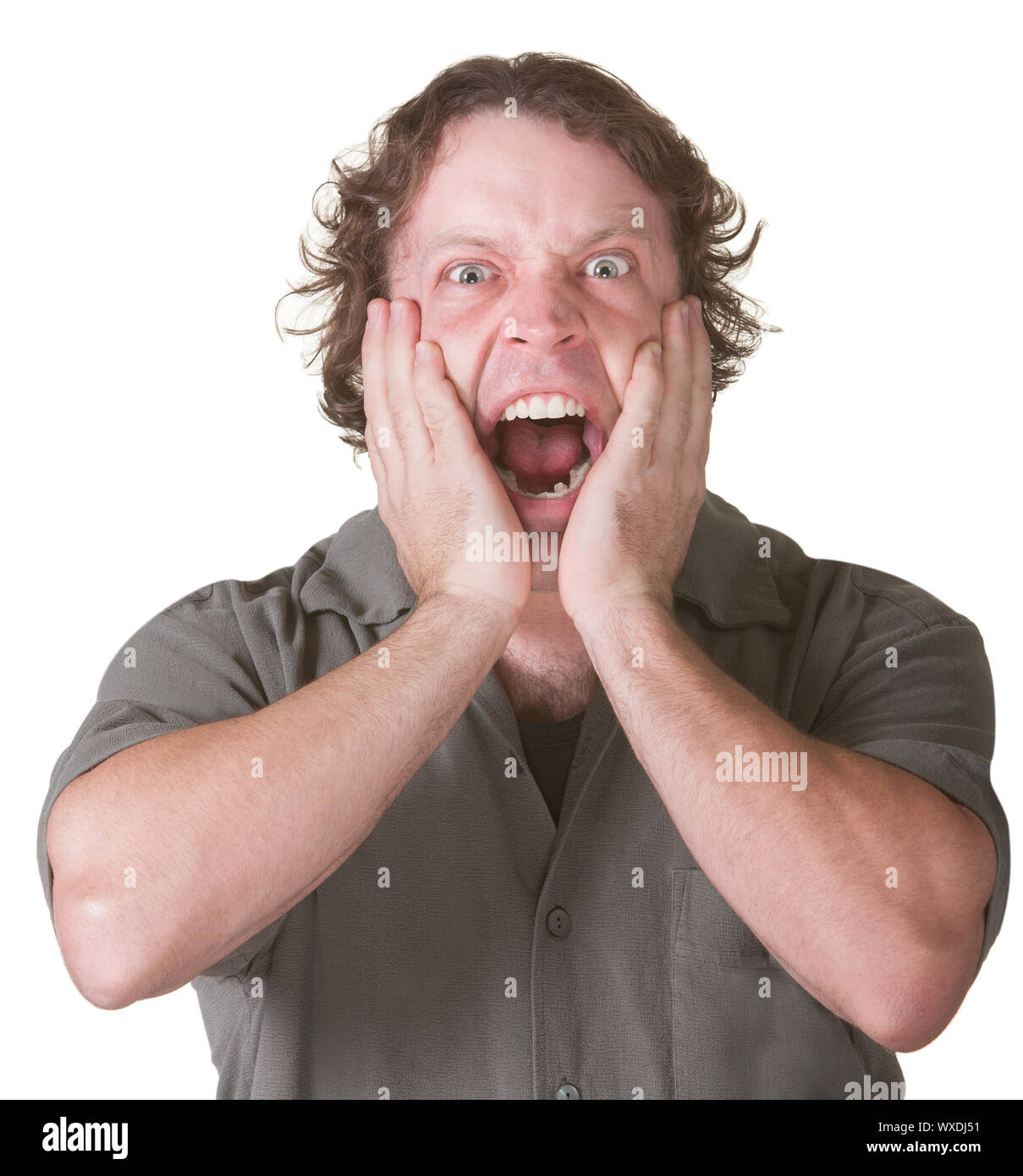 Man over white background overreacting with hands on face Stock Photo ...