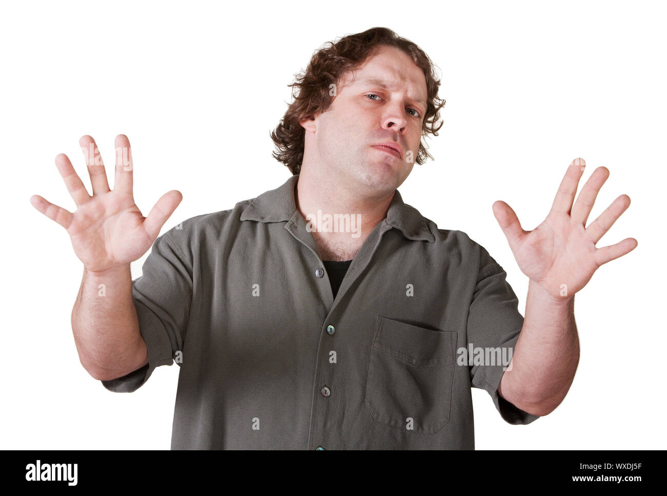 Suspicious man with arms and hands out on isolated background Stock ...