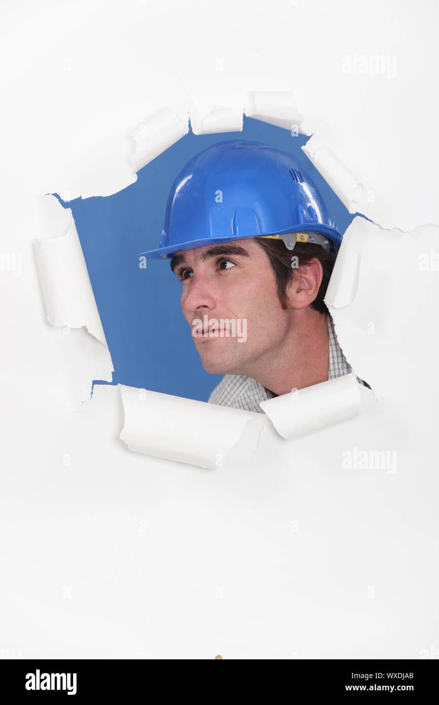 Architect peering through hole Stock Photo - Alamy Architect peering through hole Stock Photo - Alamy
