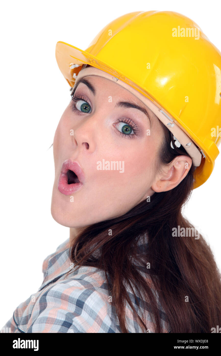 Surprised female builder Stock Photo - Alamy