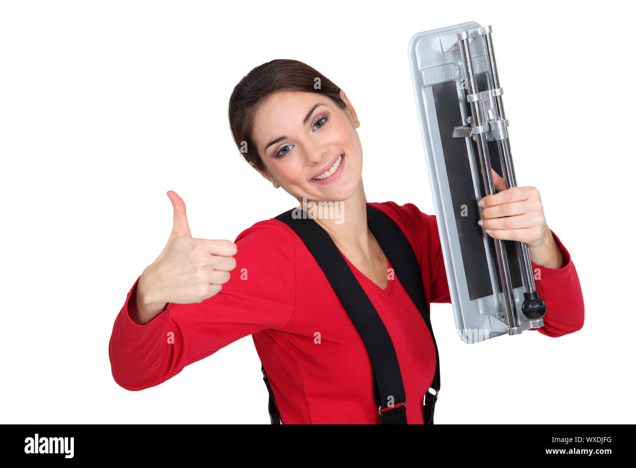 A female tiler giving the thumb up Stock Photo - Alamy
