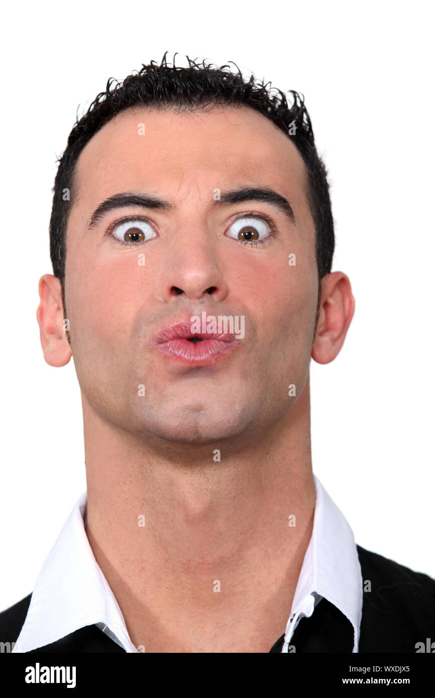 Man pulling a face Stock Photo - Alamy