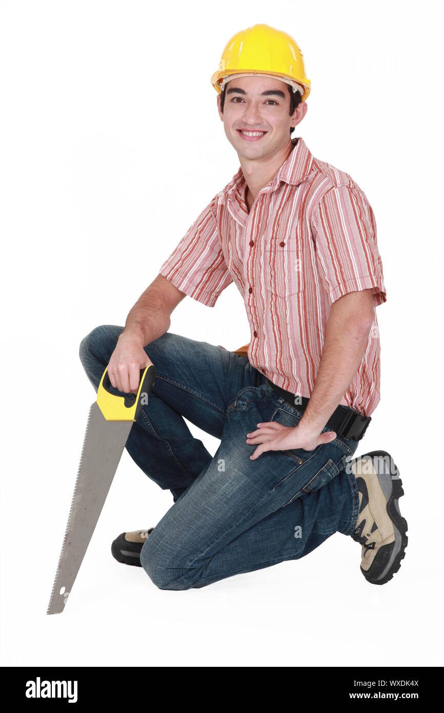 Man kneeling saw hi-res stock photography and images - Alamy
