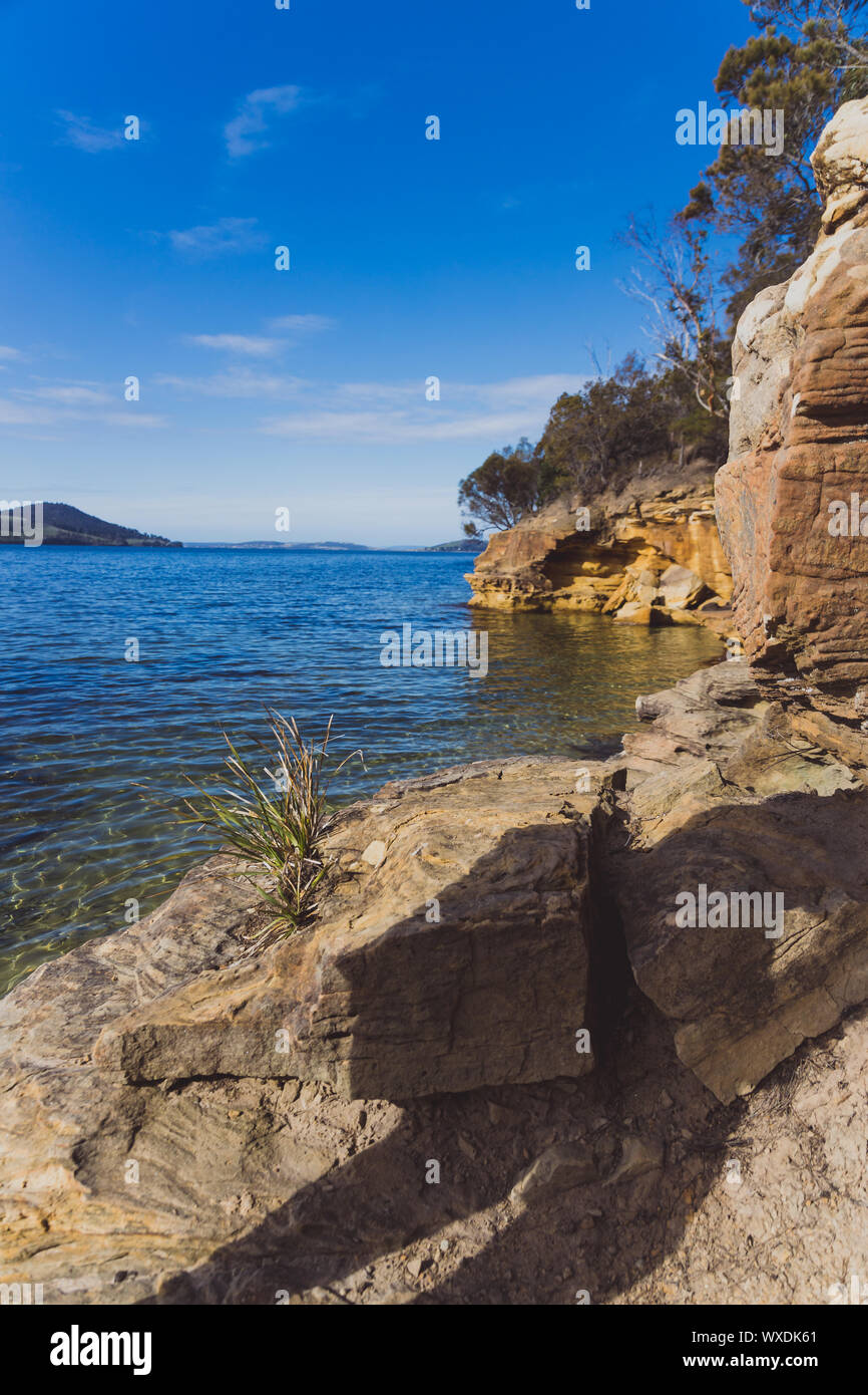 view of Conningham Beach in Tasmania, Australia with sunshine and no ...