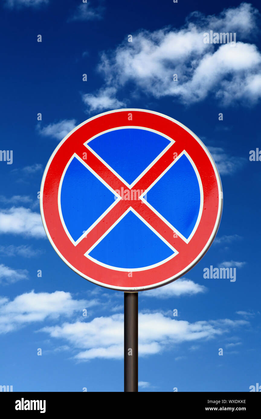 road sign no parking against blue sky and clouds Stock Photo - Alamy