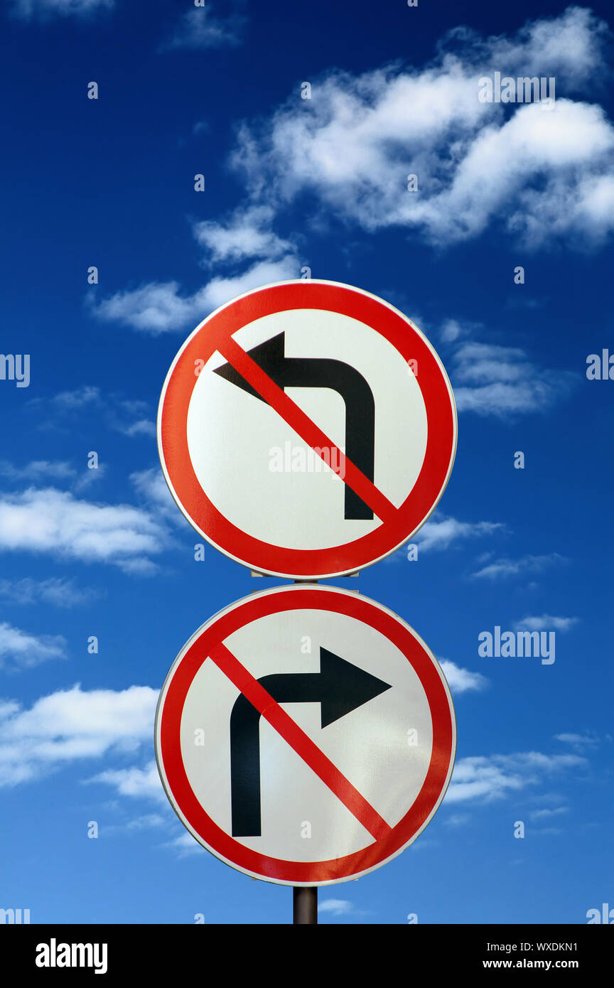 two opposite road signs against blue sky and clouds Stock Photo - Alamy
