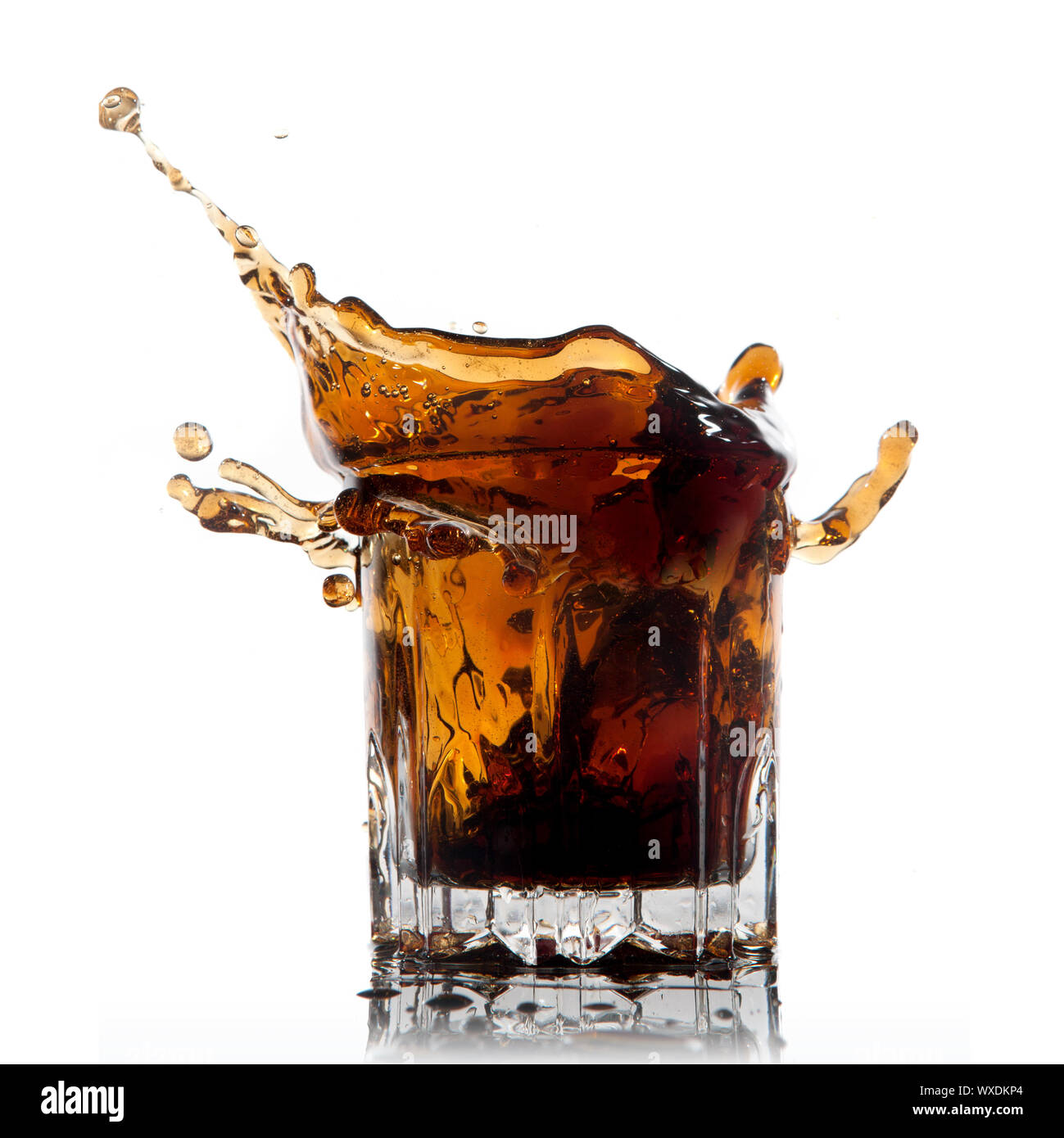 splash of cola in glass isolated on white Stock Photo - Alamy