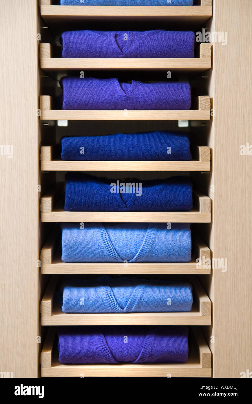store shelf with color clothes Stock Photo - Alamy