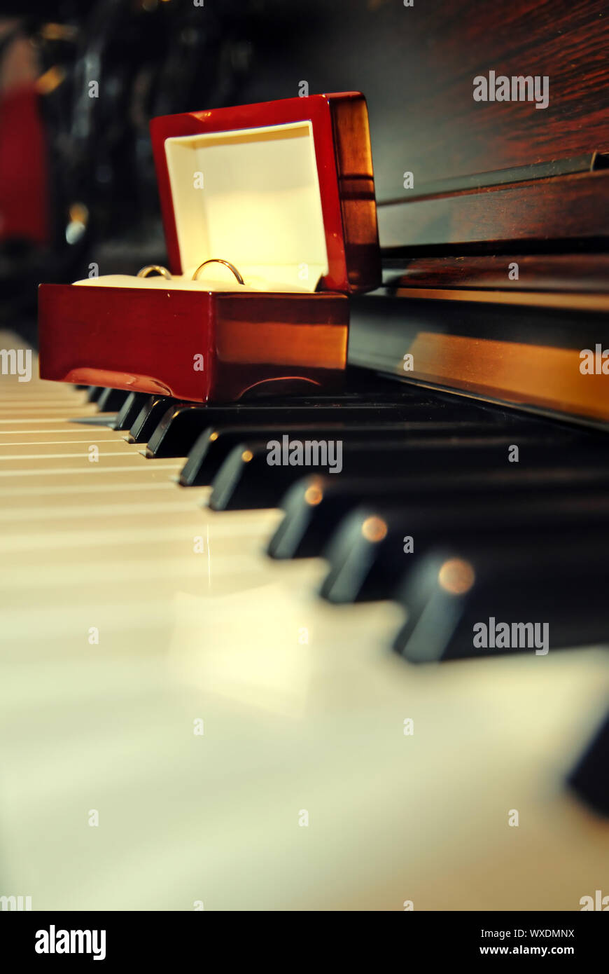 Wedding rings on the piano Stock Photo - Alamy