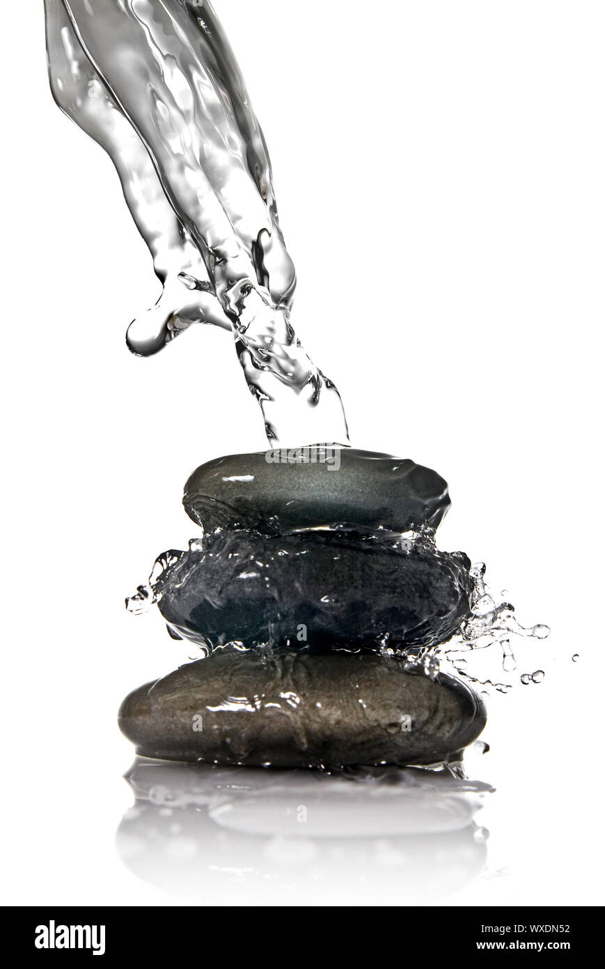 Spa stones with water splash isolated on white Stock Photo - Alamy