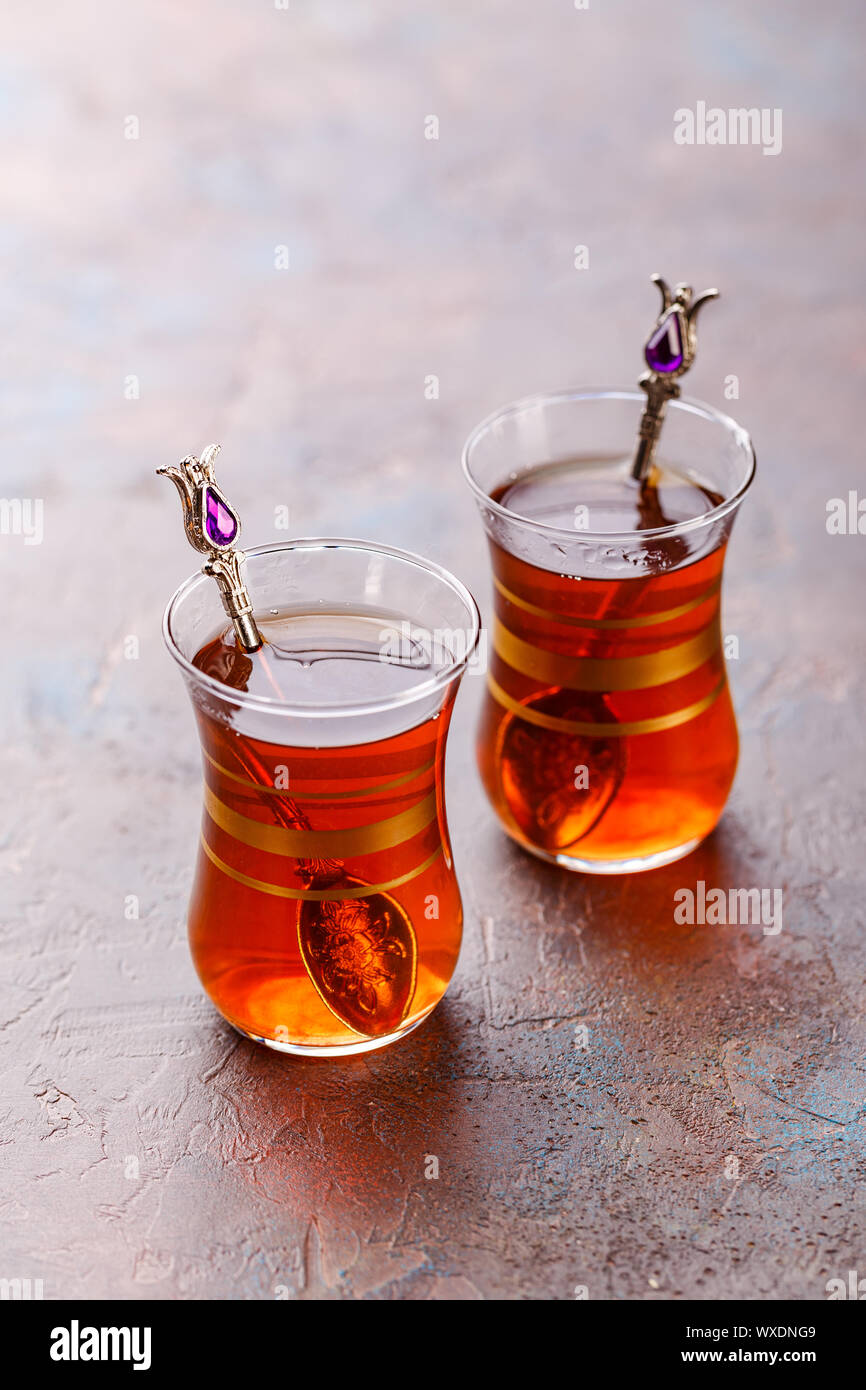 Traditional Turkish arabic dessert and a glass of tea with mint Stock ...