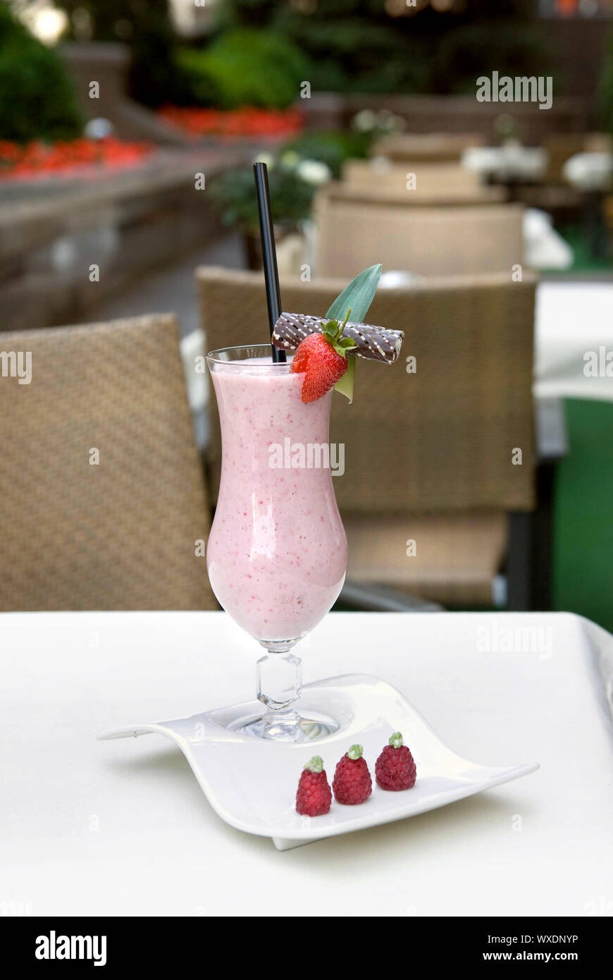 strawberry milkshake on the table Stock Photo - Alamy
