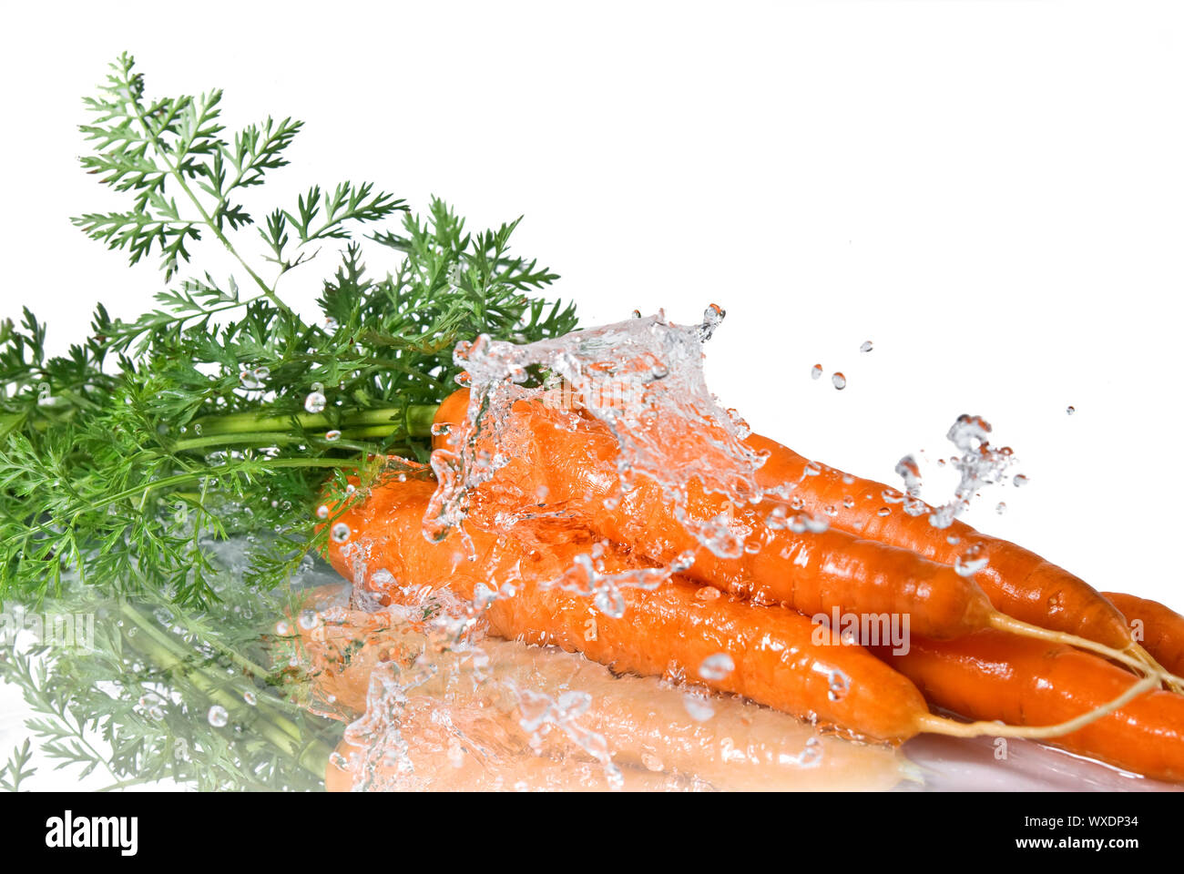 fresh water splash on carrot isolated on white Stock Photo - Alamy