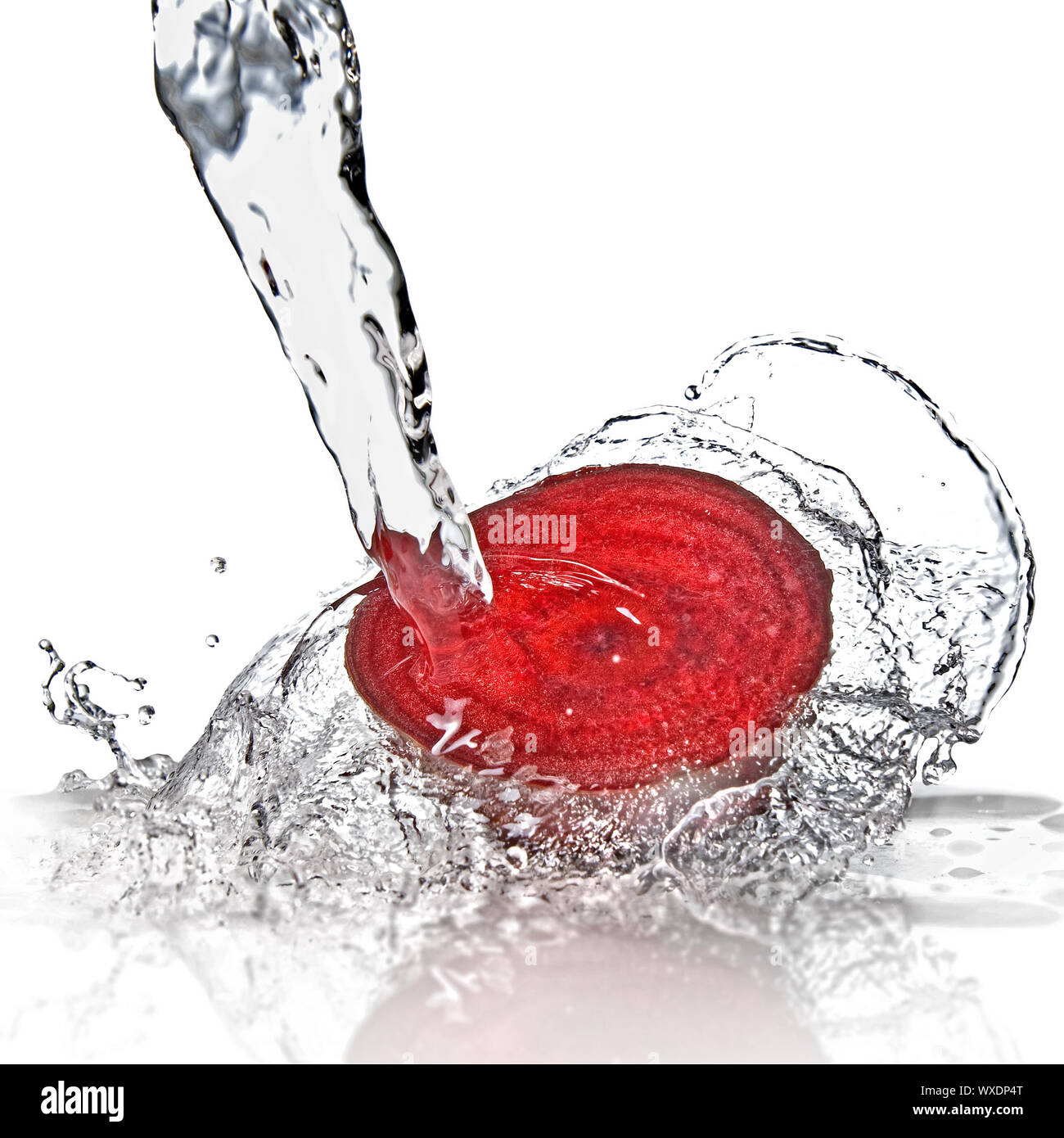 red beet with water splash isolated on white Stock Photo - Alamy
