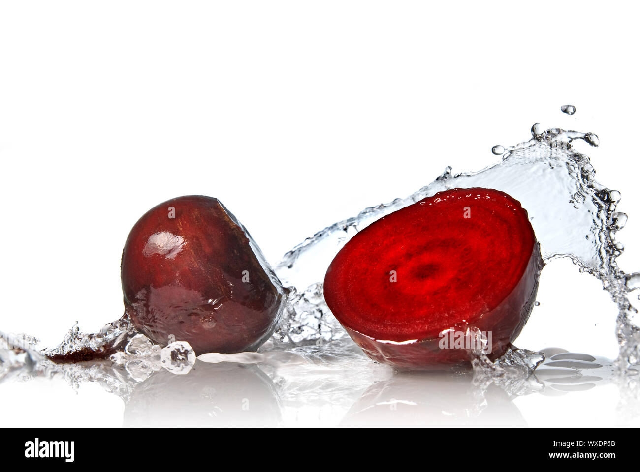 red beet with water splash isolated on white Stock Photo - Alamy
