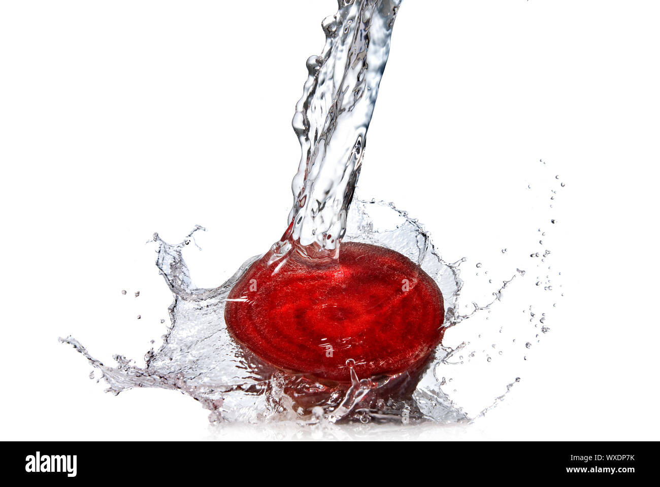 red beet with water splash isolated on white Stock Photo - Alamy