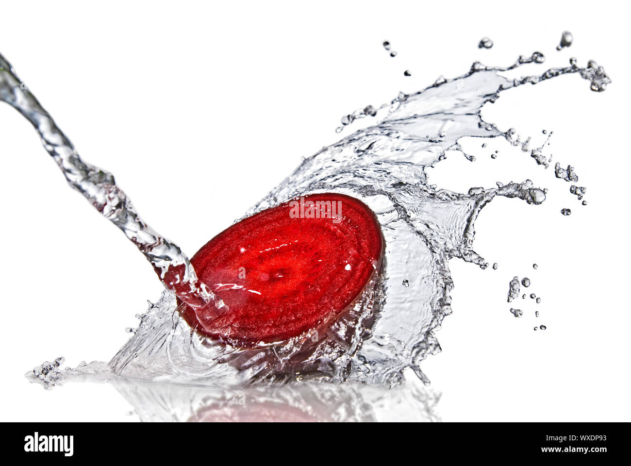red beet with water splash isolated on white Stock Photo - Alamy