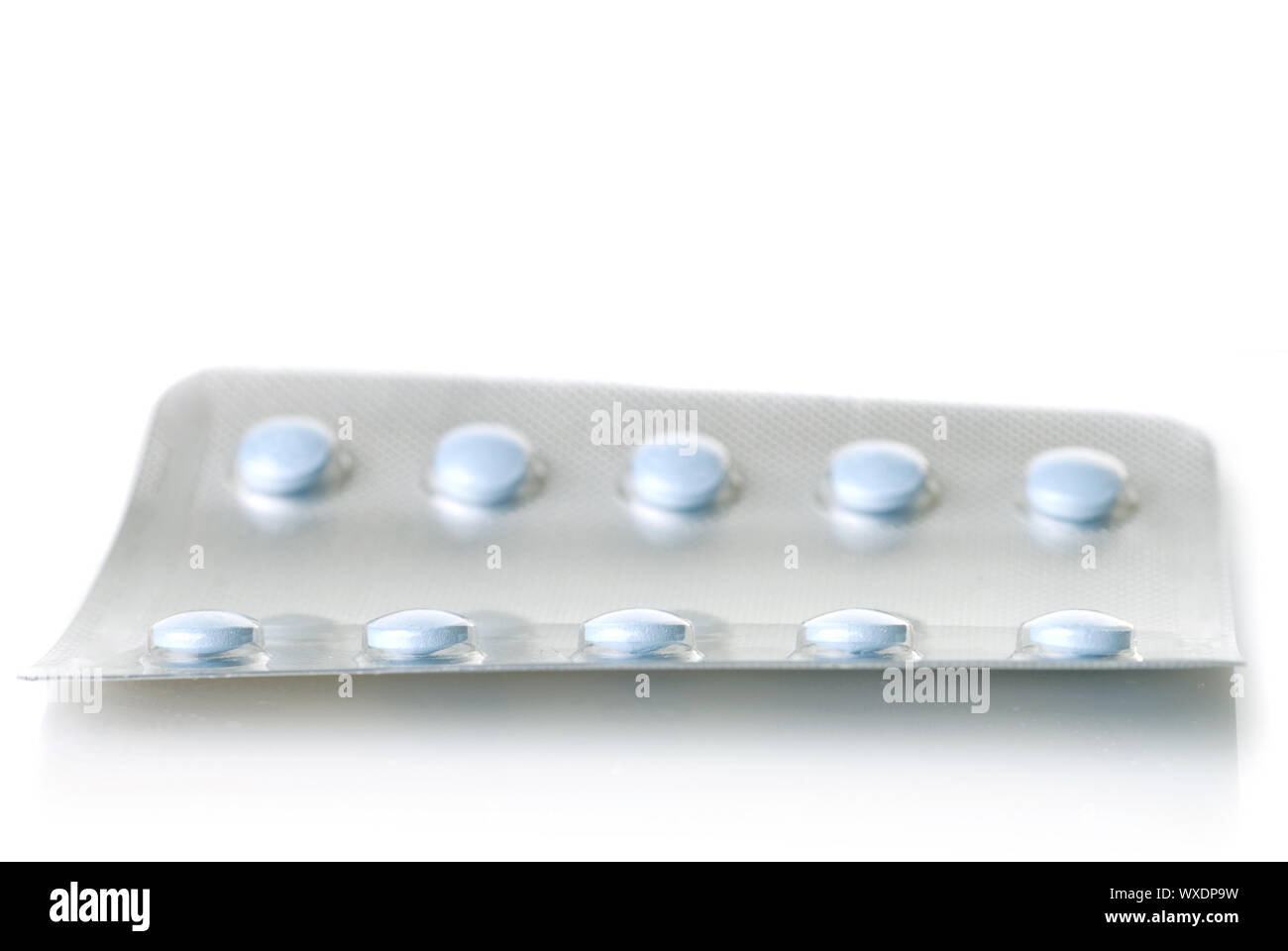 pack of blue tablets isolated on white Stock Photo - Alamy