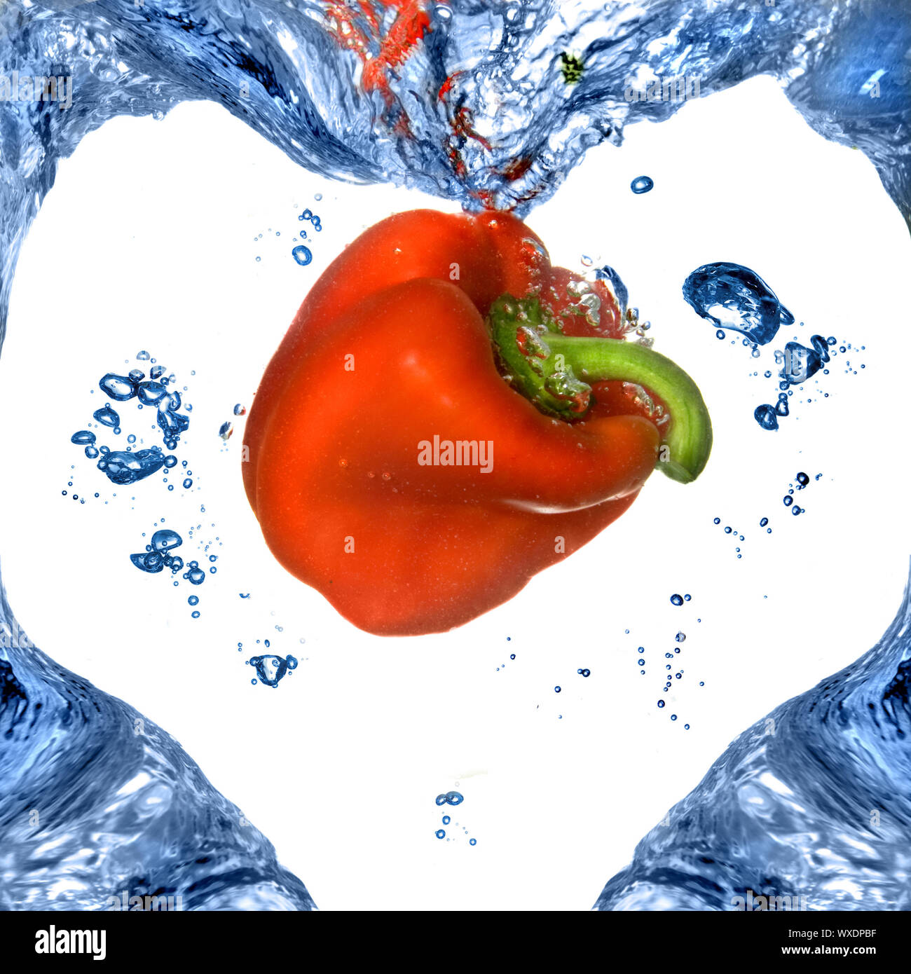 Red pepper with shape of heart from blue water isolated on white Stock ...