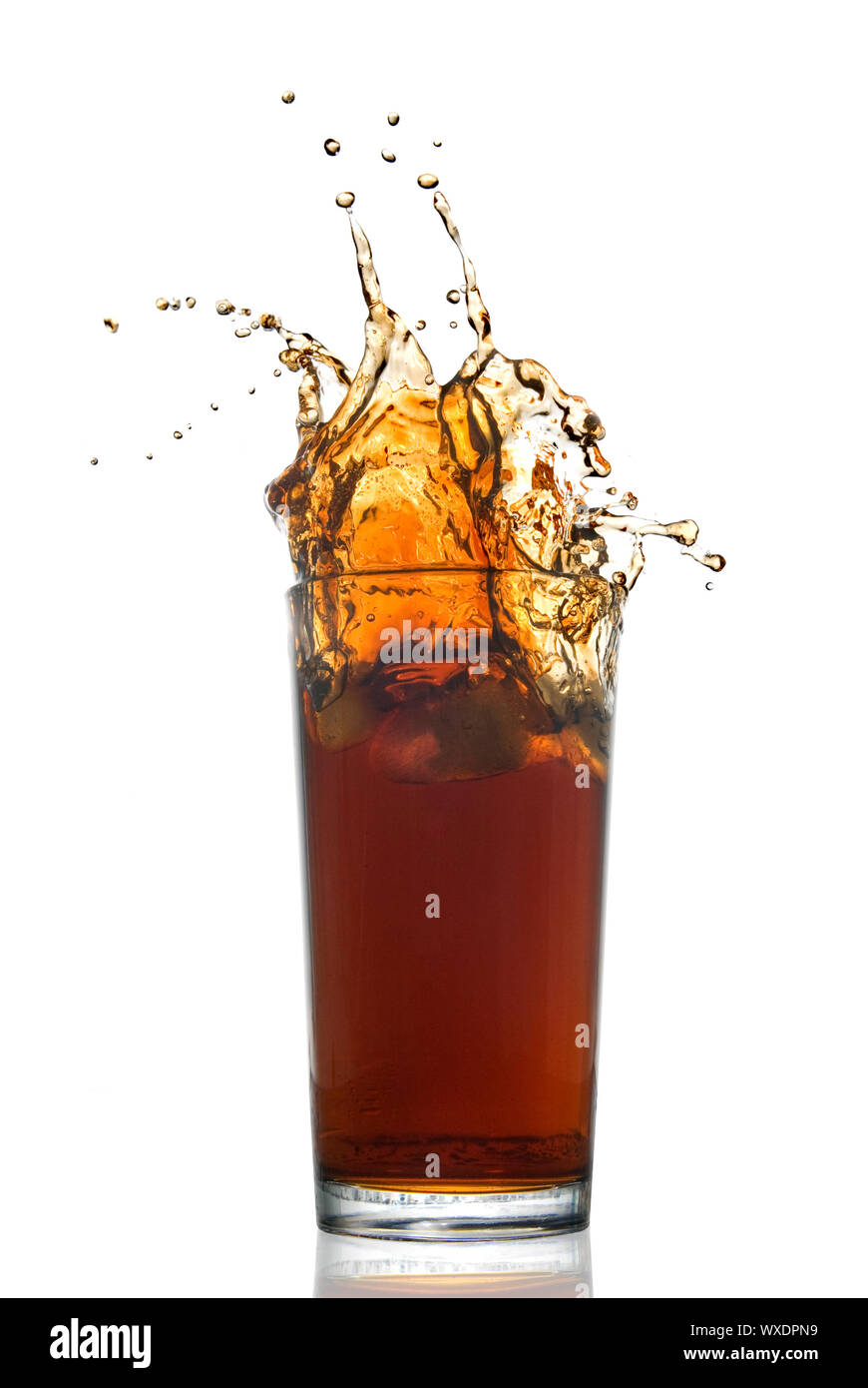 Beautiful splash of cola in glass isolated on white Stock Photo - Alamy