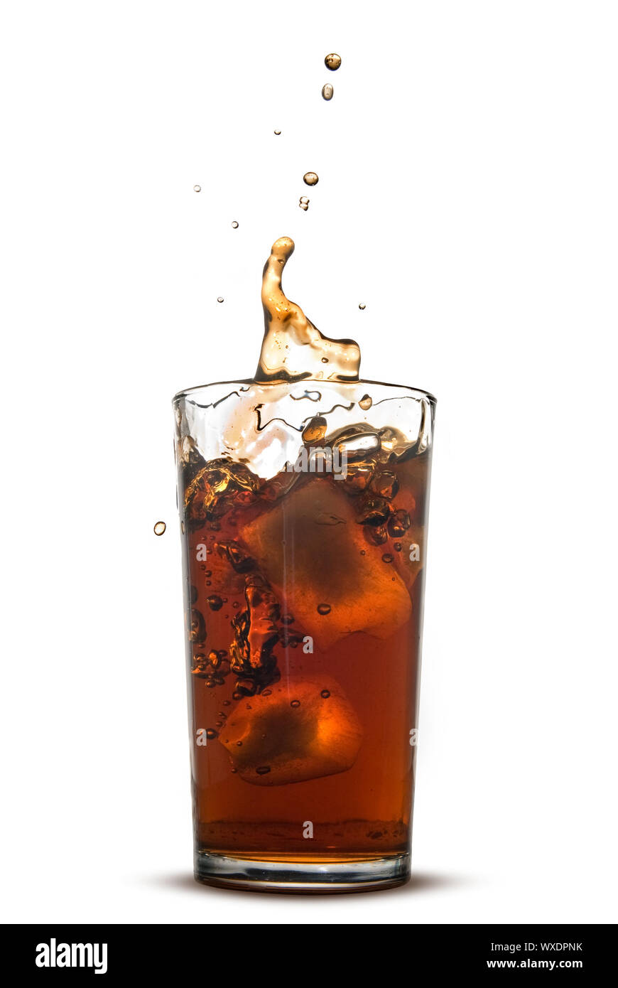 Beautiful splash of cola in glass isolated on white Stock Photo - Alamy