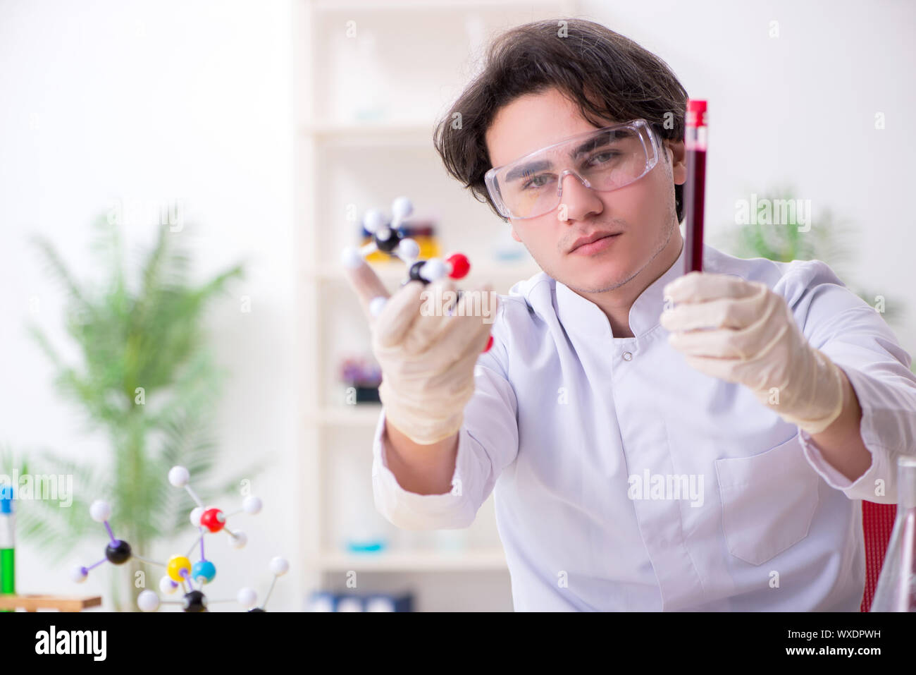 Young biochemist testing blood hi-res stock photography and images - Alamy