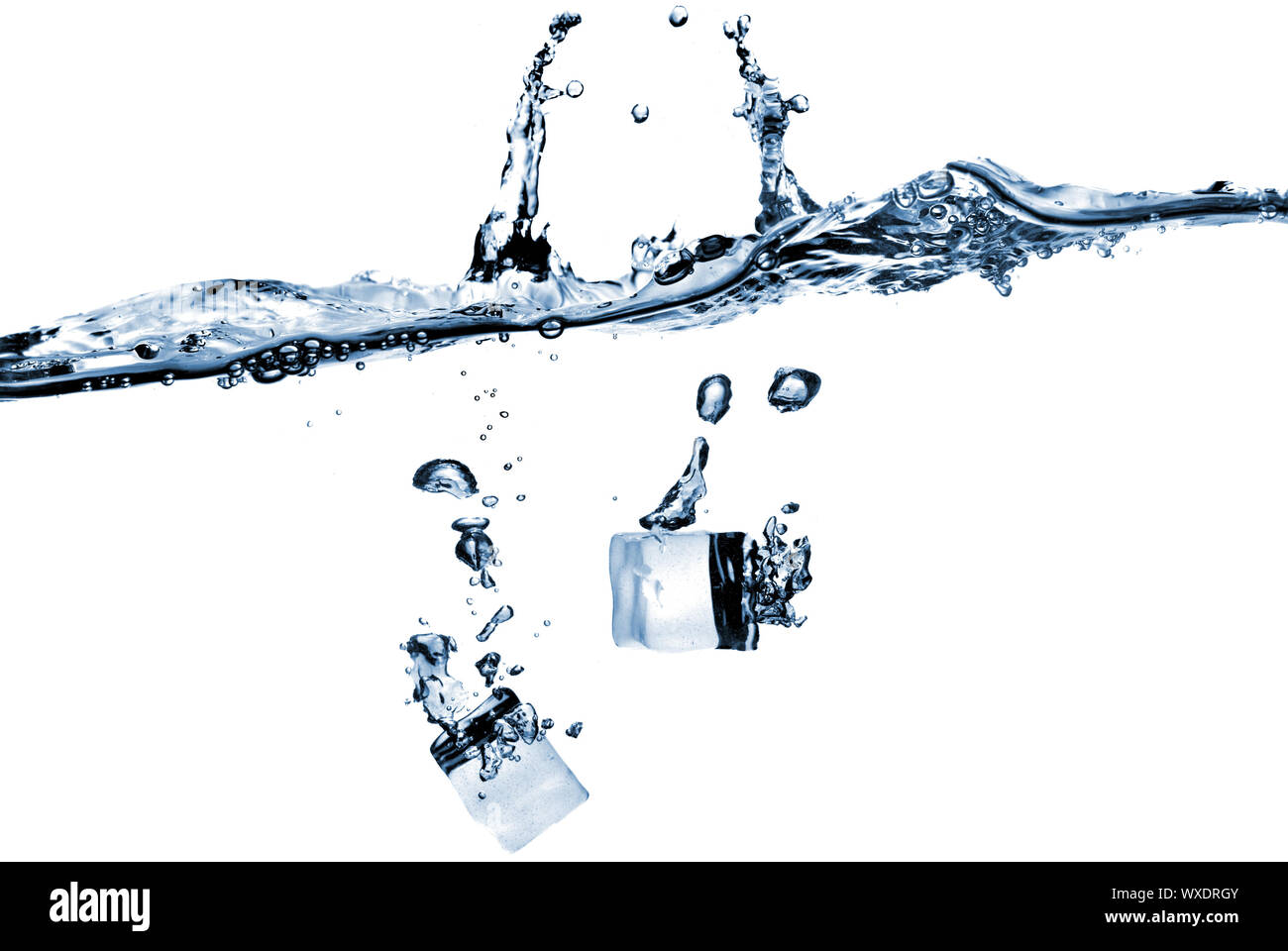 ice cubes dropped into water with splash isolated on white Stock Photo - Alamy