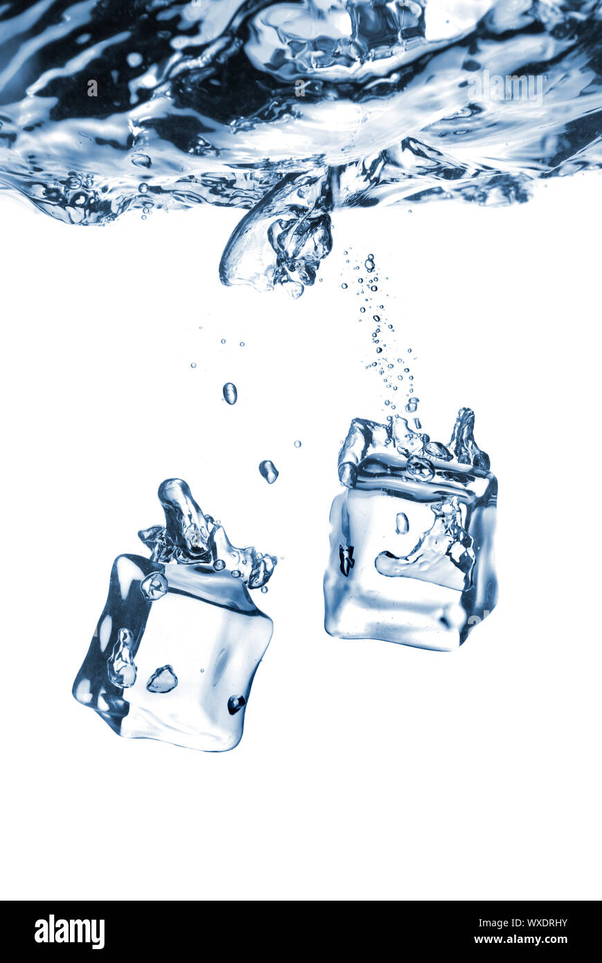 ice cubes dropped into water with bubbles isolated on white Stock Photo ...