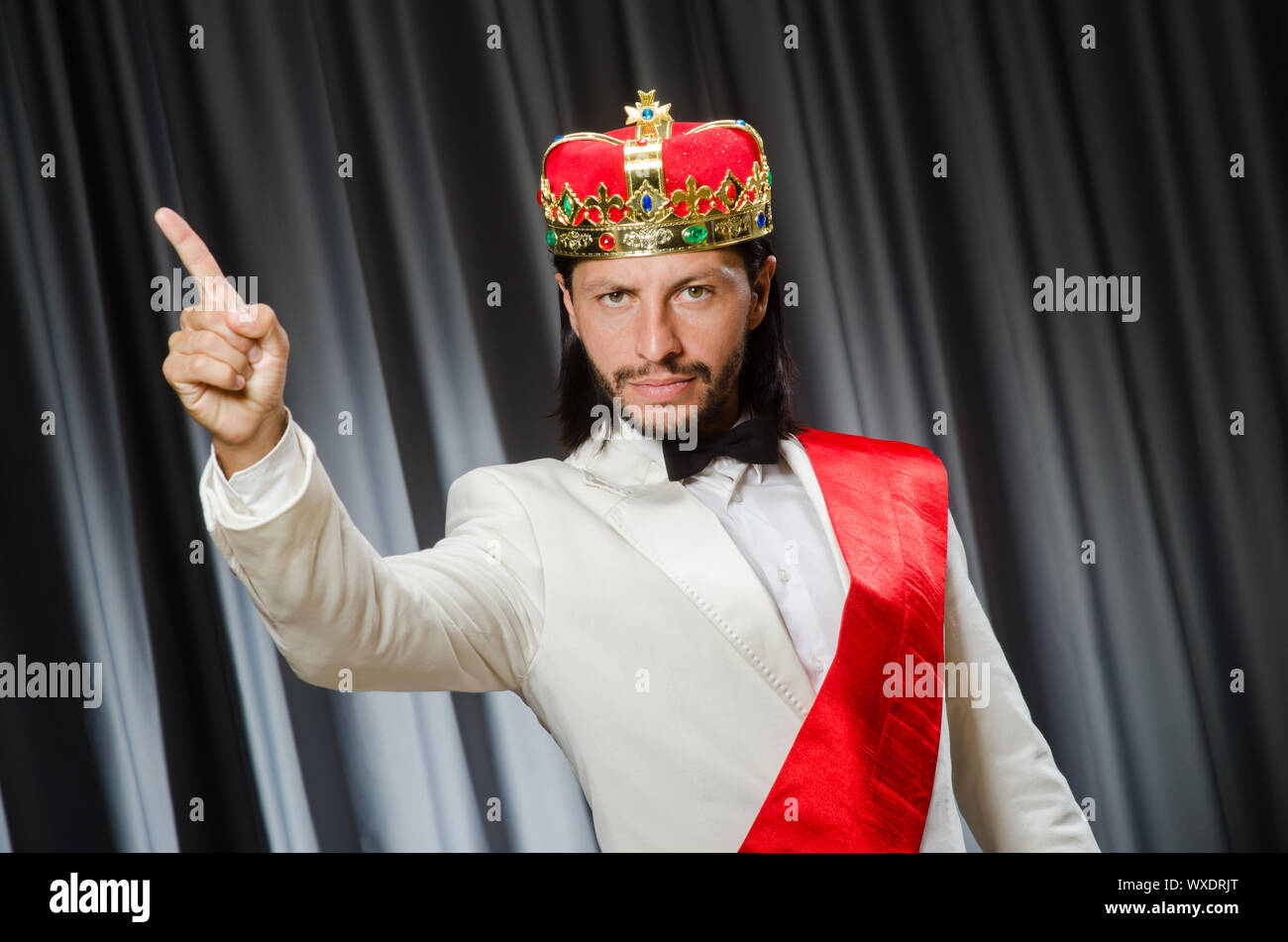 Funny king wearing crown in coronation concept Stock Photo - Alamy