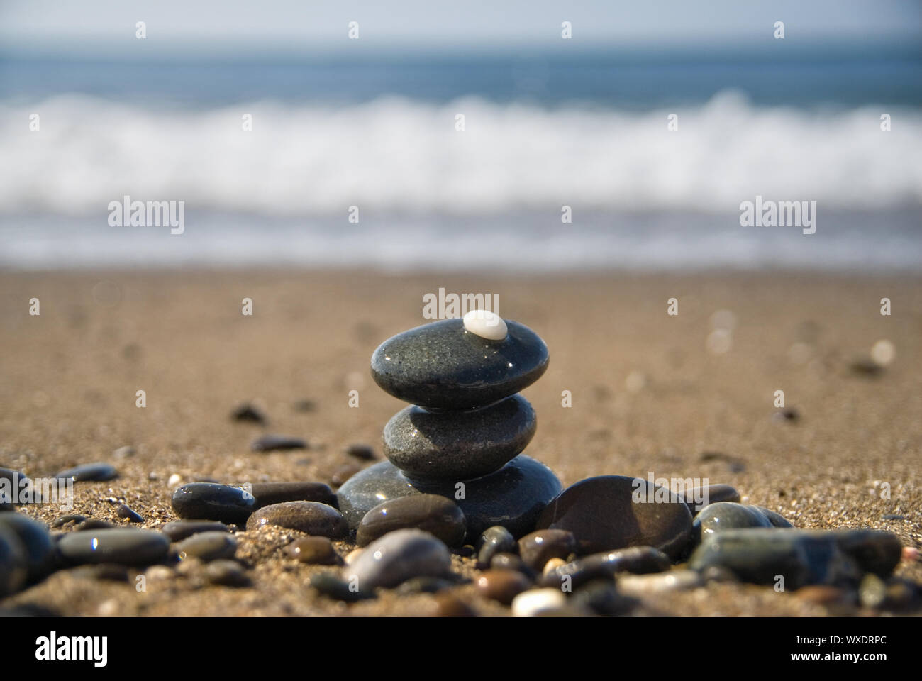 stones and water wave Stock Photo - Alamy