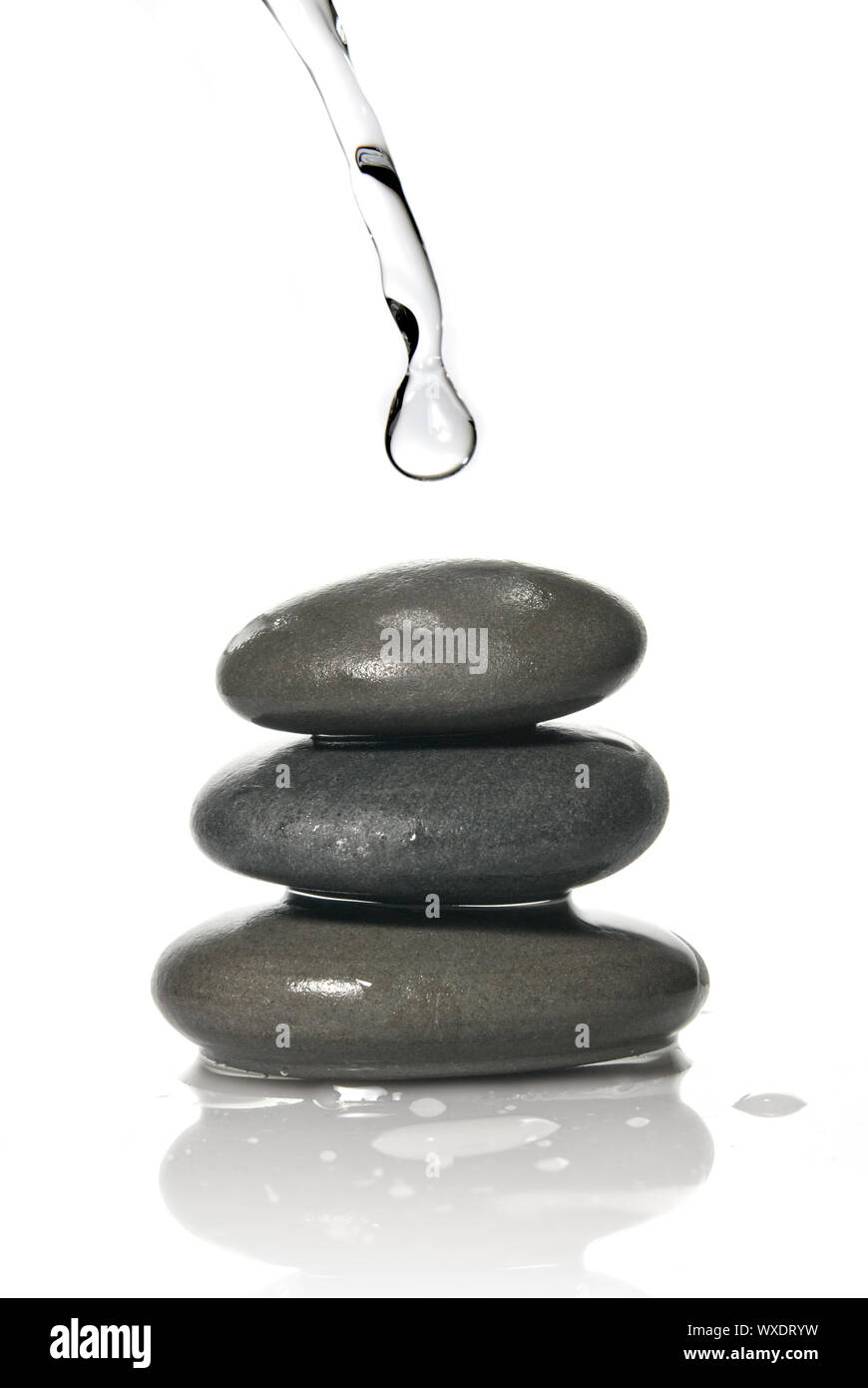 Spa stones with water splash isolated on white Stock Photo - Alamy