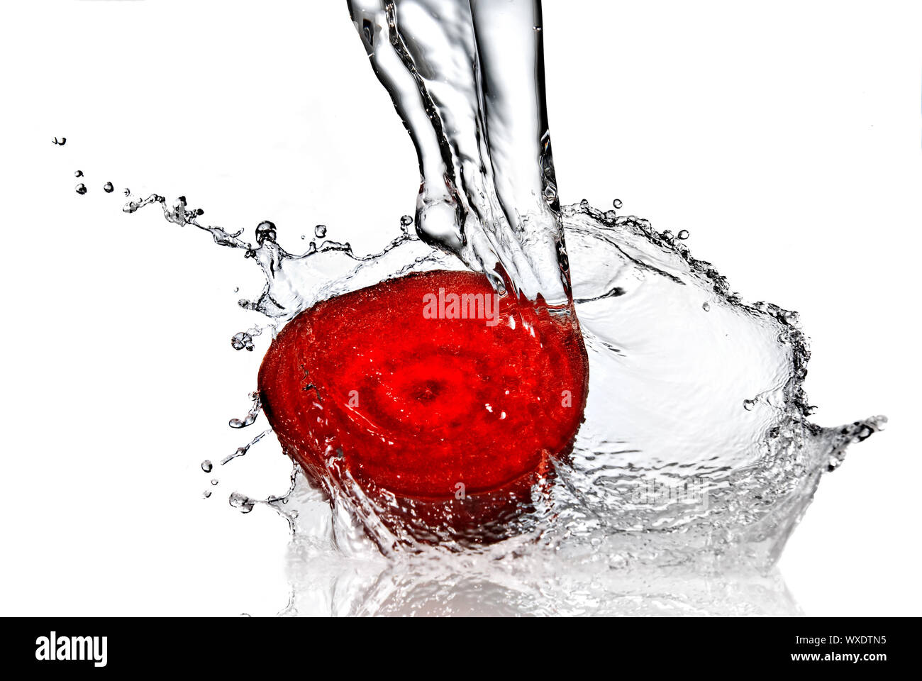 red beet with water splash isolated on white Stock Photo - Alamy