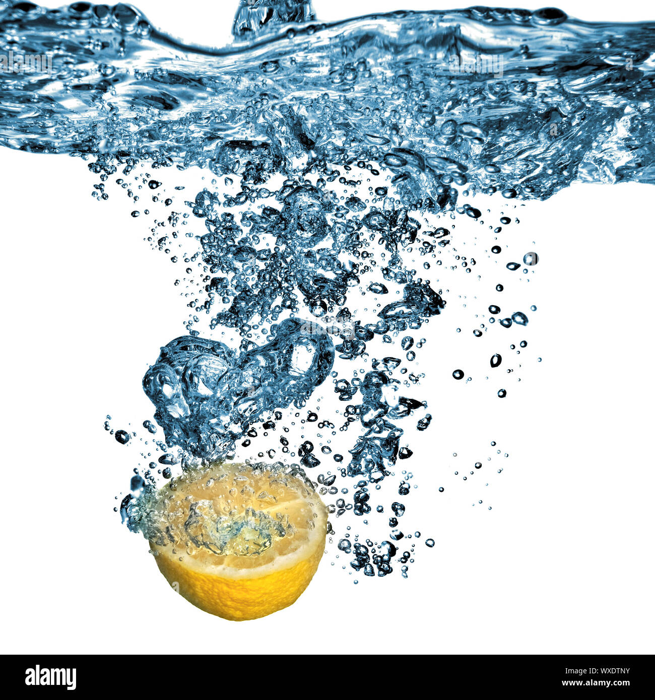 Fresh lemon dropped into water with bubbles isolated on white Stock Photo - Alamy