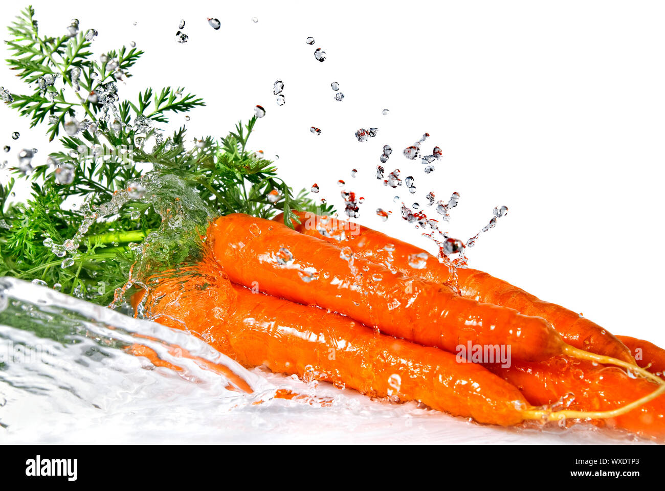 fresh water splash on carrot isolated on white Stock Photo - Alamy