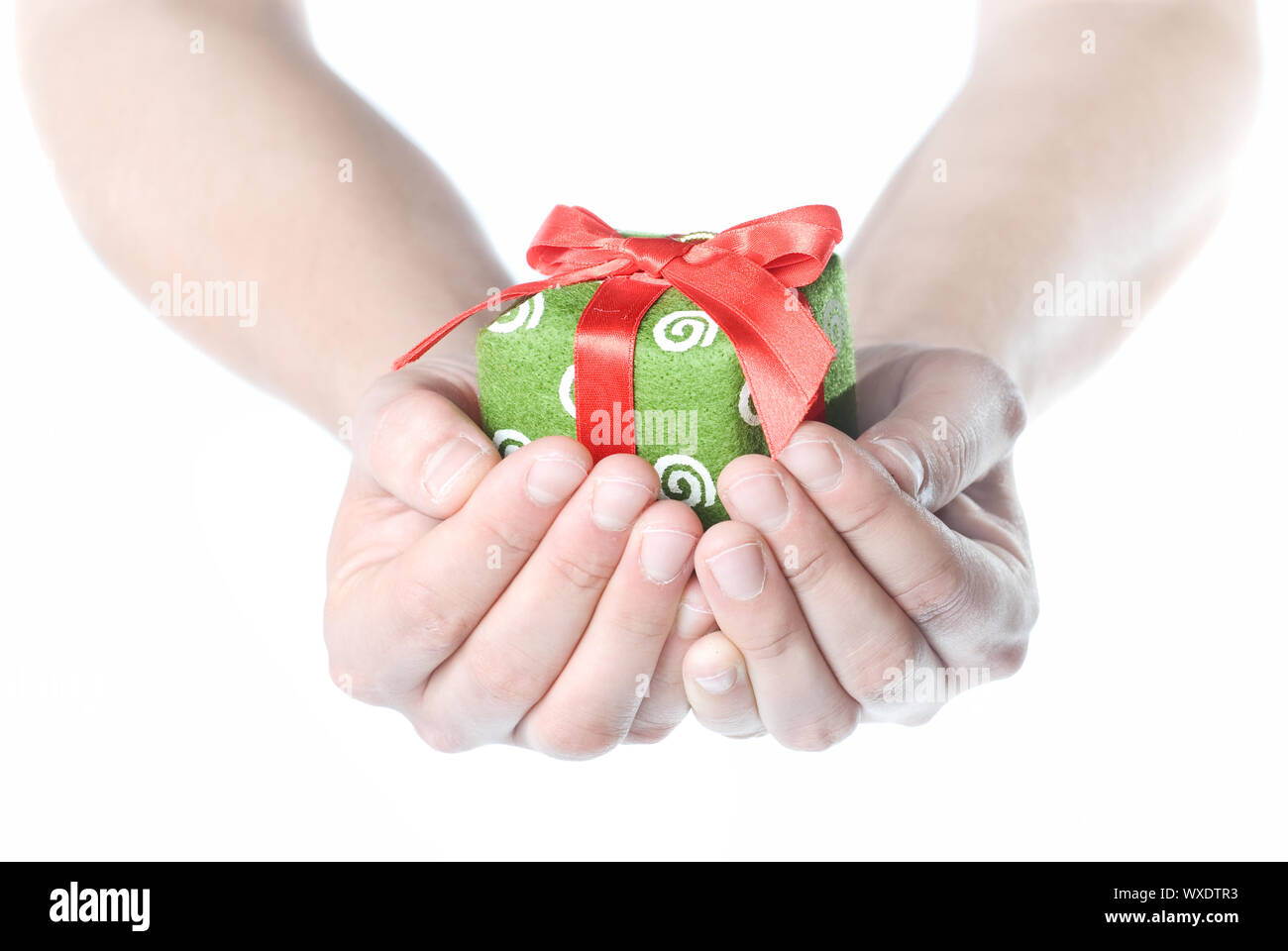 Hands holding gift isolated on white Stock Photo - Alamy
