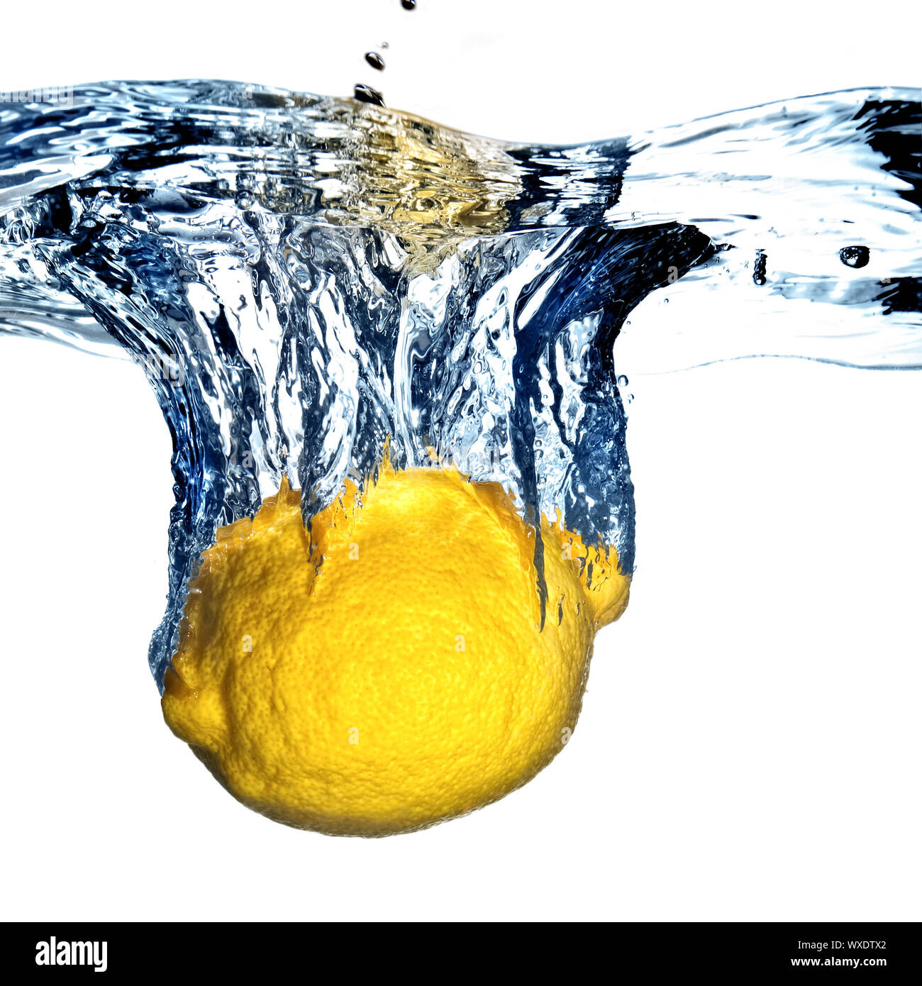 Fresh lemon dropped into water with bubbles isolated on white Stock Photo - Alamy
