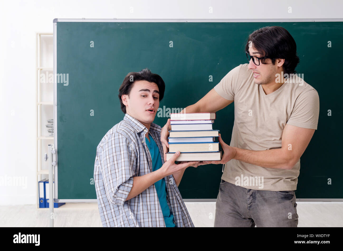 Two male students in the classroom Stock Photo - Alamy